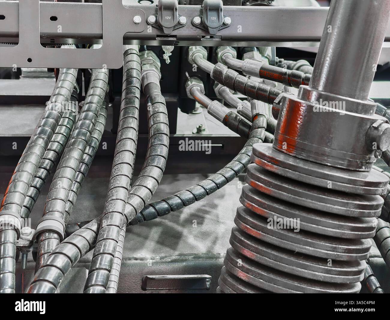 Exploring the intricate layout of hydraulic connectors and hoses in a ...