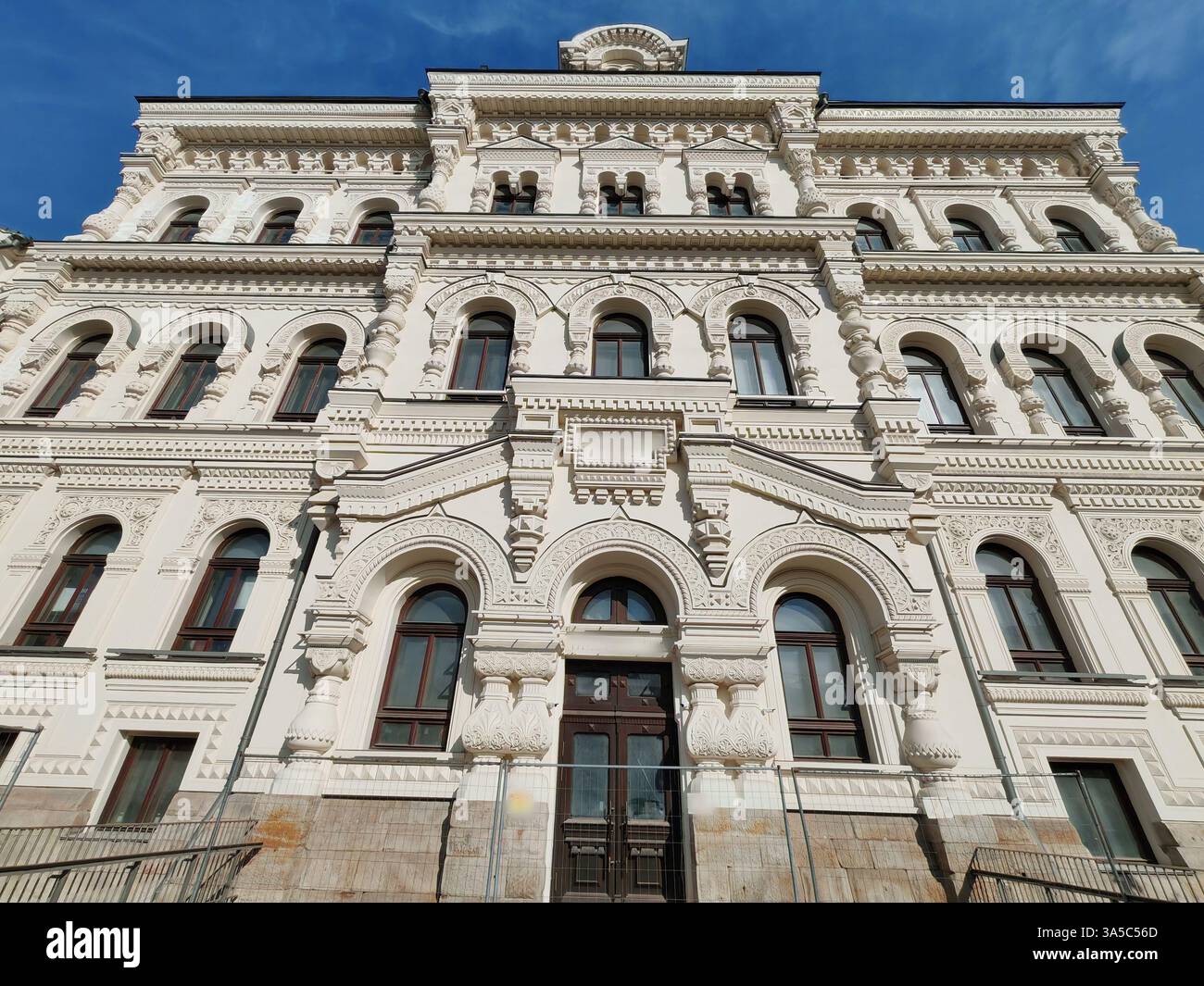 A richly detailed historic building with ornate carvings, arched ...