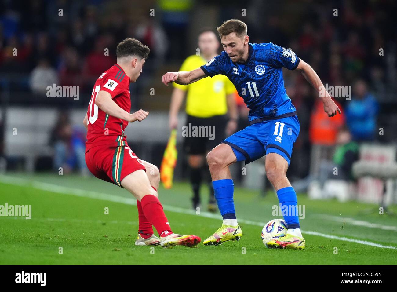 Kazakhstan's Yan Vorogovsky (right) and Wales' Daniel James battle for ...