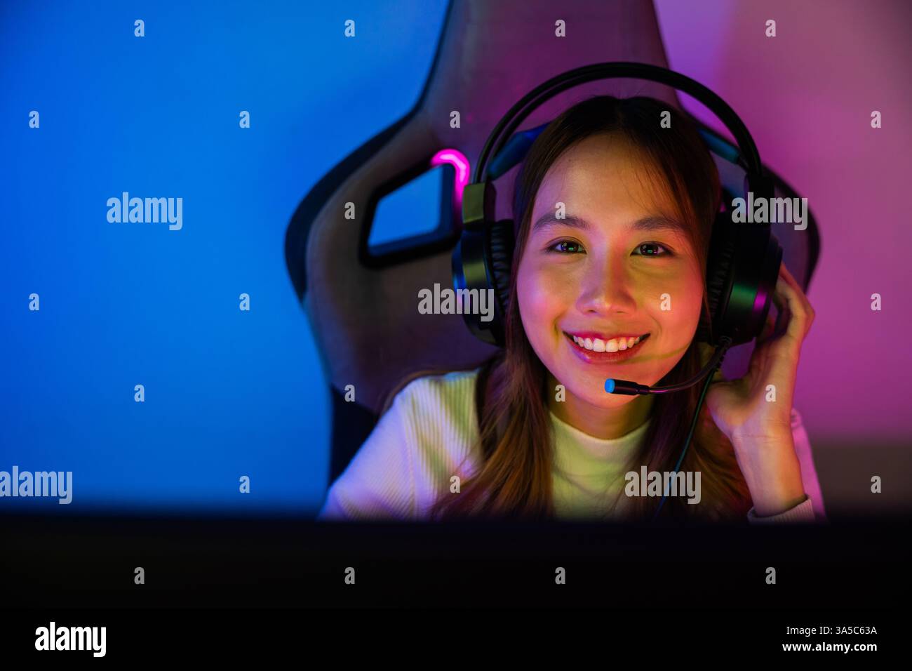 Asian happy Gamer endeavor plays online video games tournament with ...