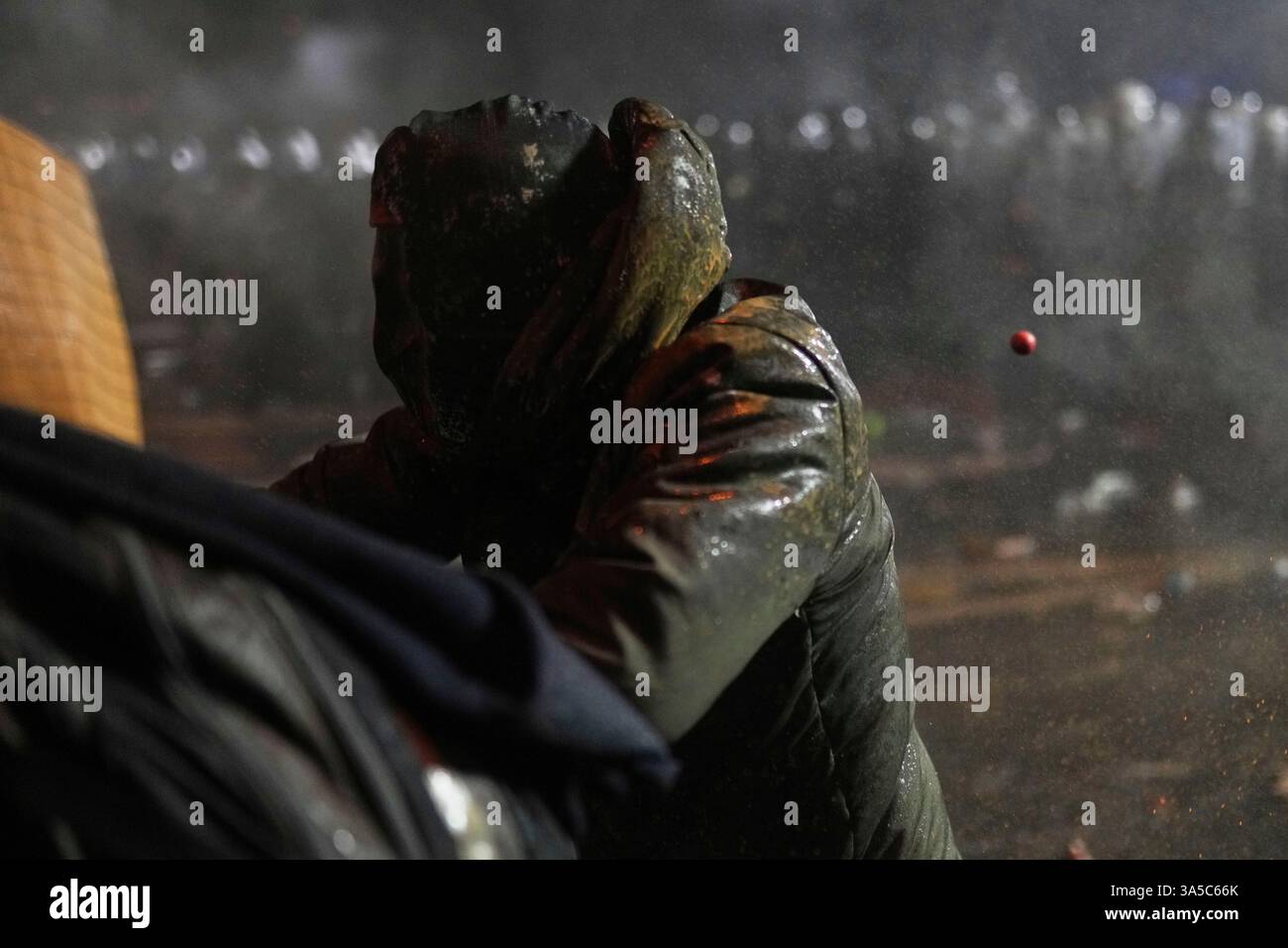 Riot police fire tear gas pellets to disperse protesters during a ...