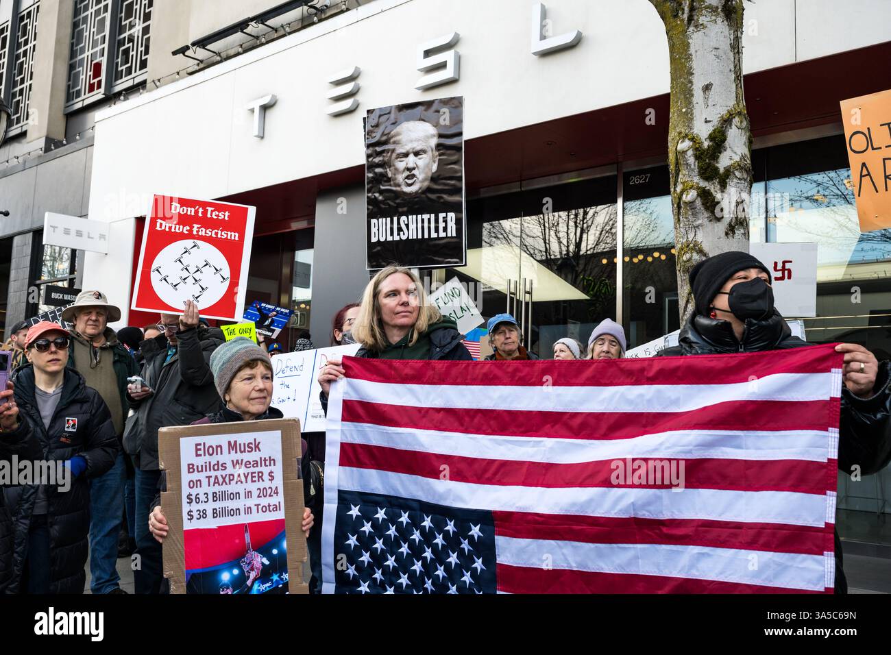 Seattle, USA. 22nd Mar 2025. Just after 10:00am Activists descend on ...