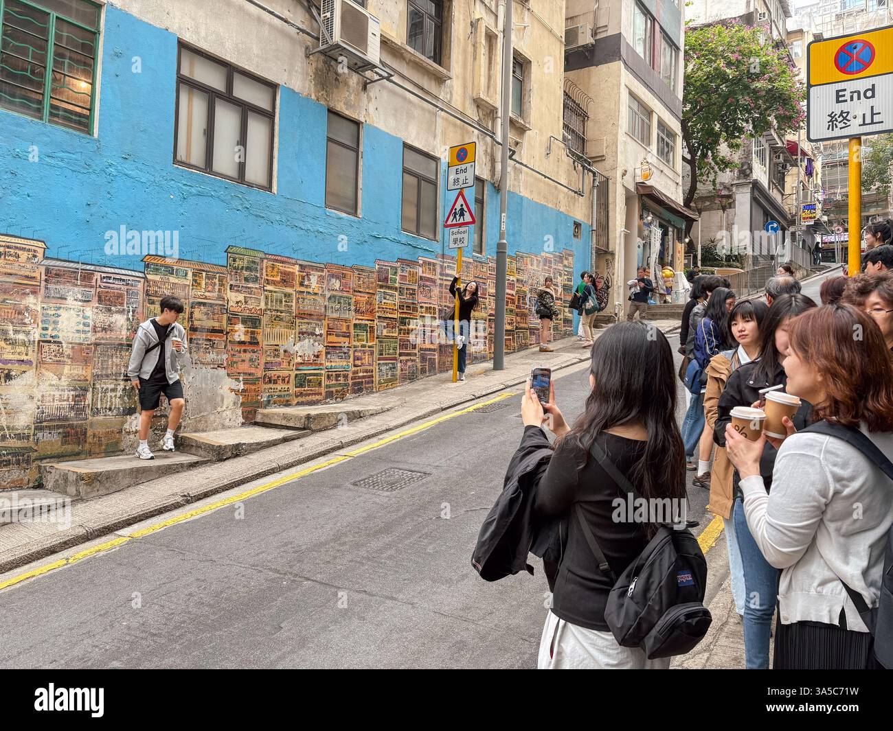 Graham Street Market Wall in Hong Kong showing the mural with crowds of ...