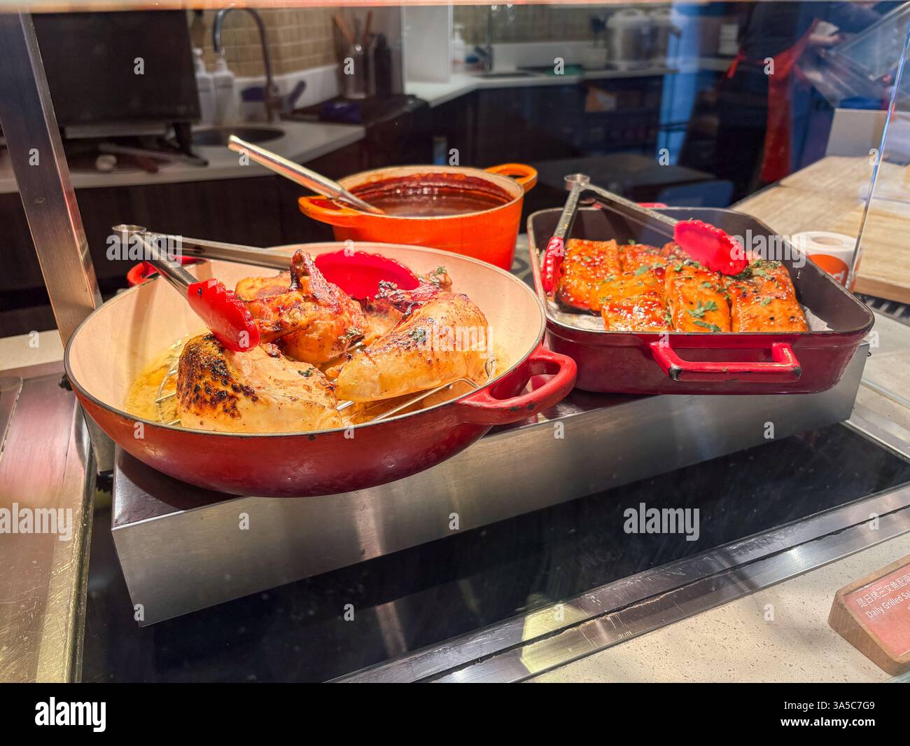 Food bar with daily grilled selections such as chicken and salmon Stock ...