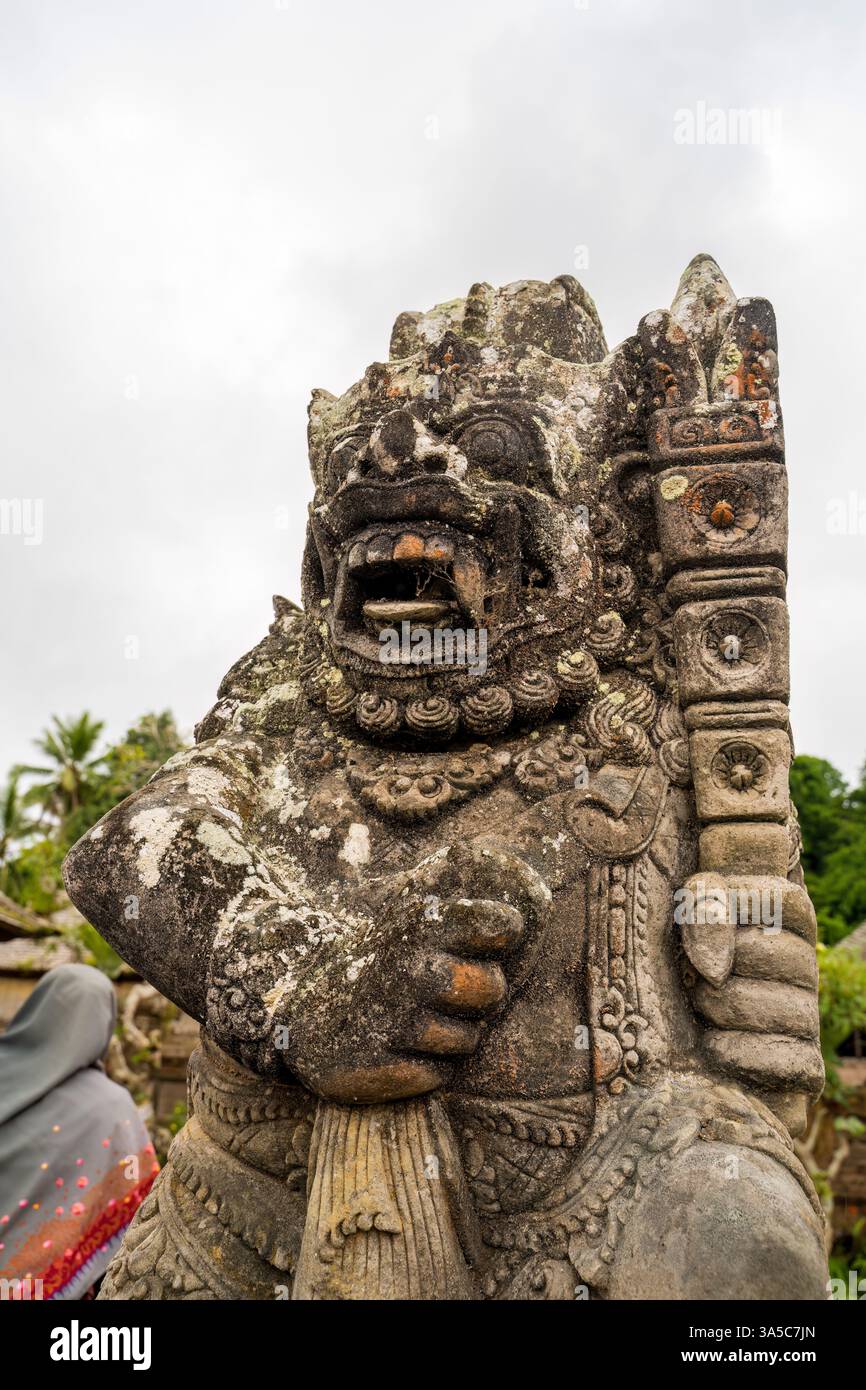 Ancient weathered stone guardian statue with fierce expression and ...