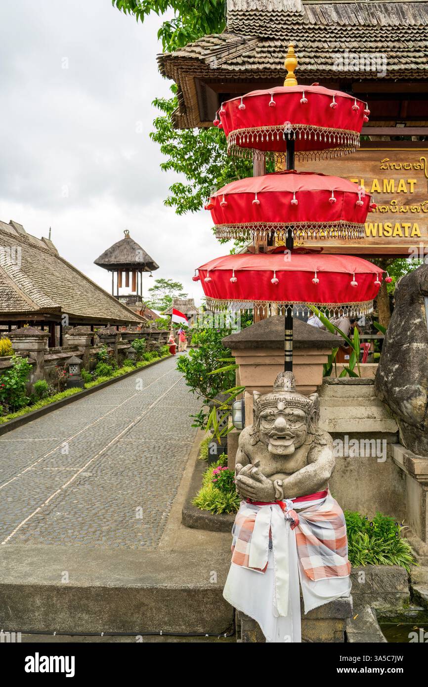 Traditional Balinese temple entrance with tiered red ceremonial ...