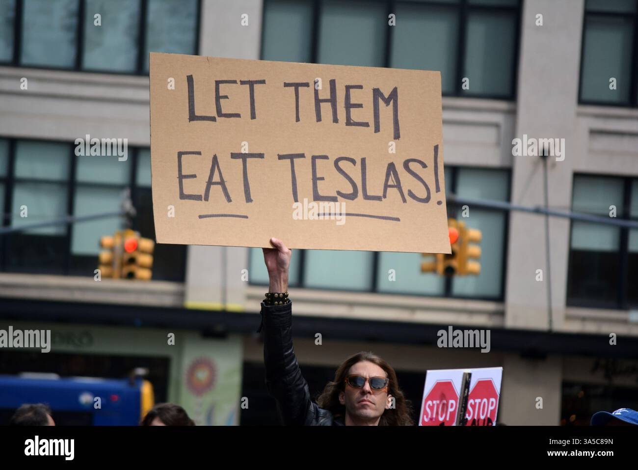 Protesters at a Tesla Takeover event against Elon Musk and DOGE in ...