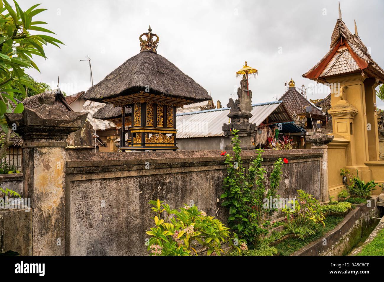 A traditional Balinese temple with intricate golden carvings and tiered ...