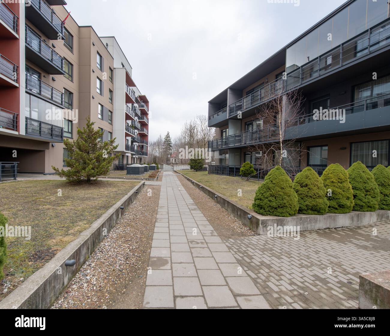 Contemporary residential building featuring multi-level balconies ...