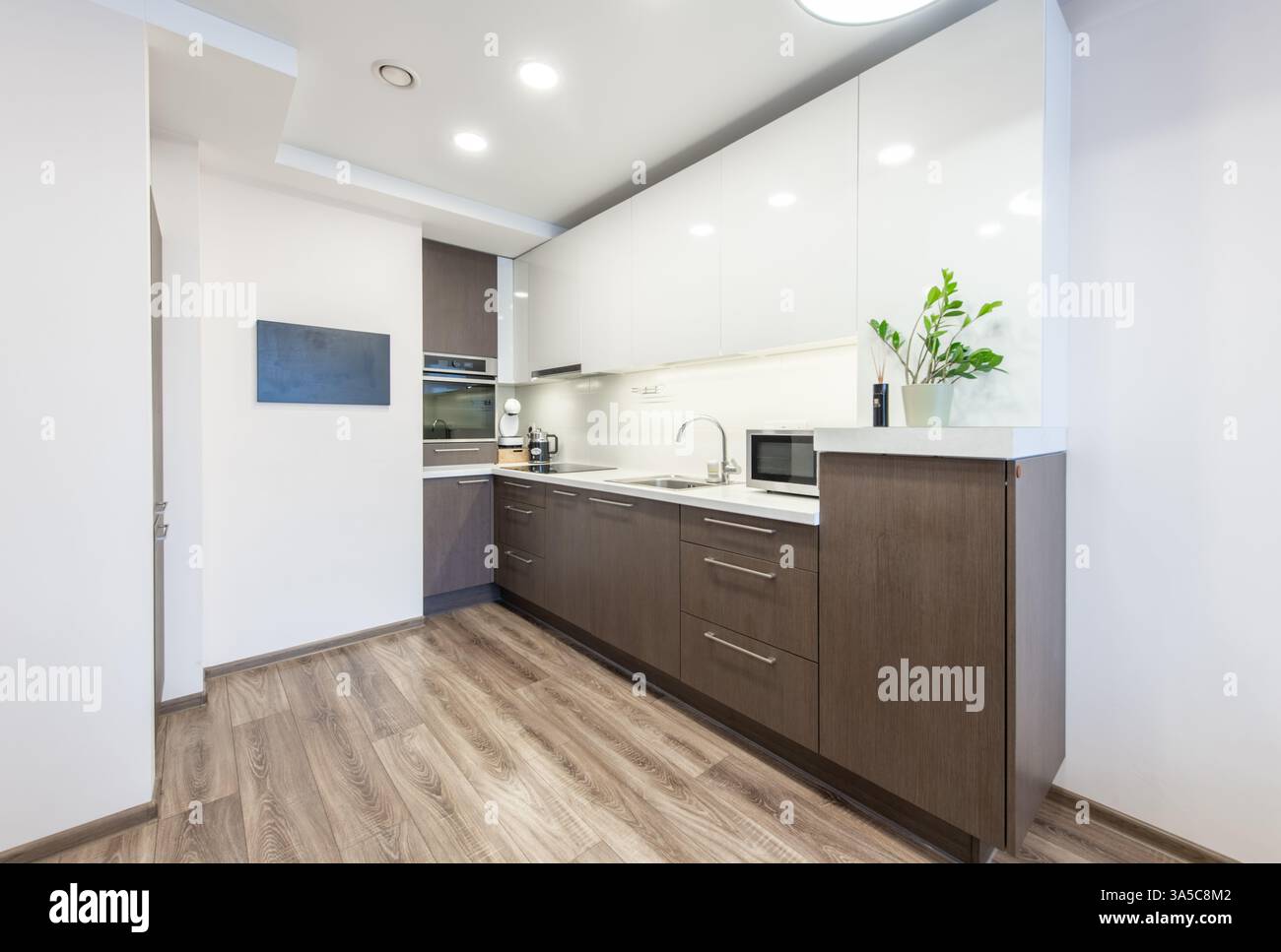 Bright and modern kitchen design featuring wooden cabinets, sleek ...