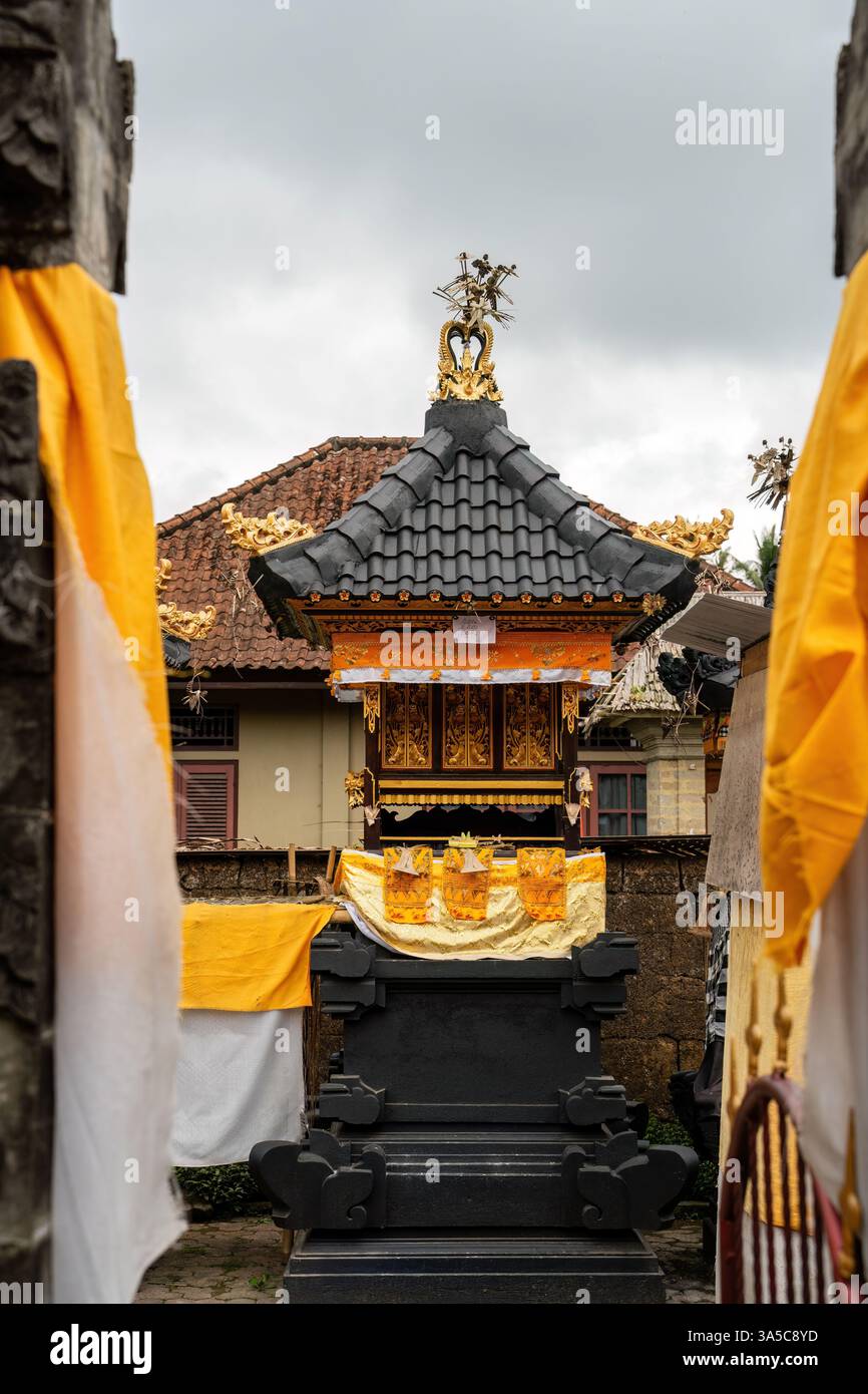 A beautifully designed Balinese temple with golden carvings and a ...
