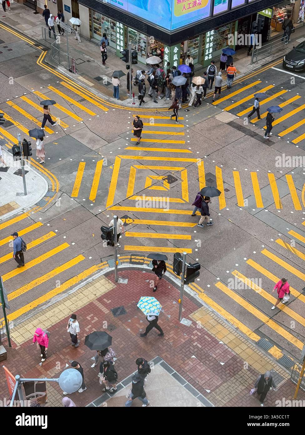 Overhead shot of crosswalks in Tsim Sha Tsui, Kowloon, Hong Kong ...
