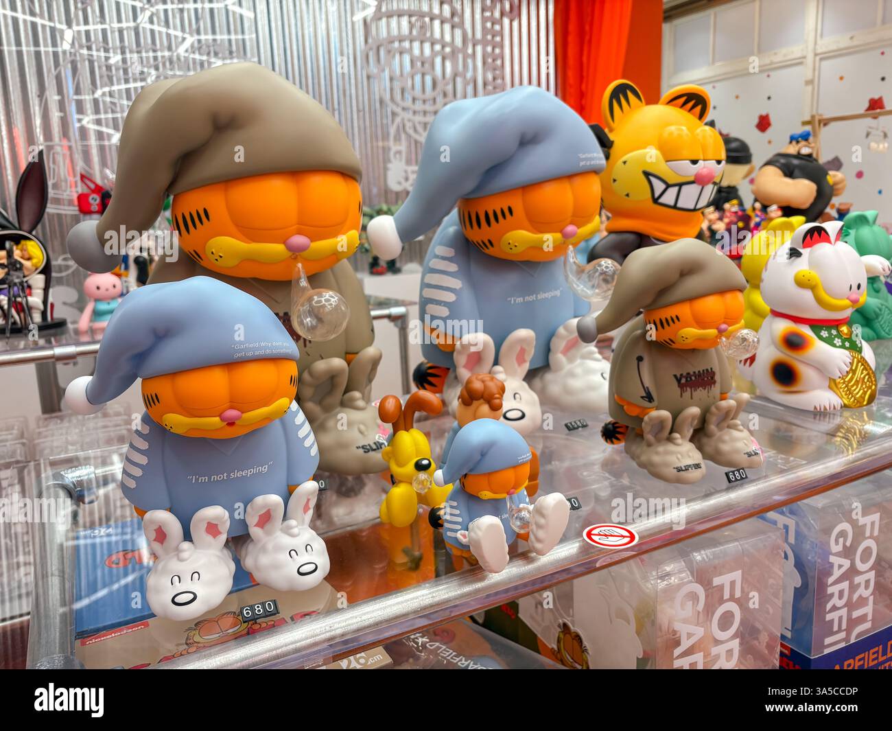 Garfield themed figures for sale in a toy store on display that ...