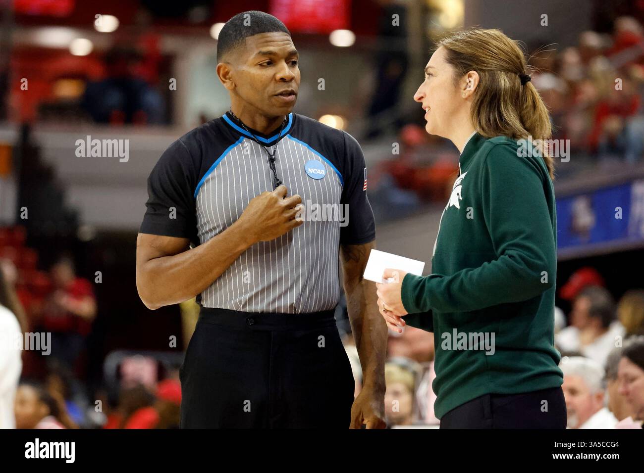 Michigan State head coach Robyn Fralick speaks with an official during ...