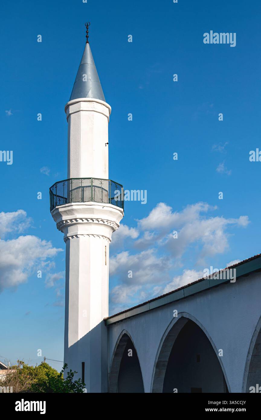 White minaret of of Hamidiye Mosque with metal top and small balcony ...