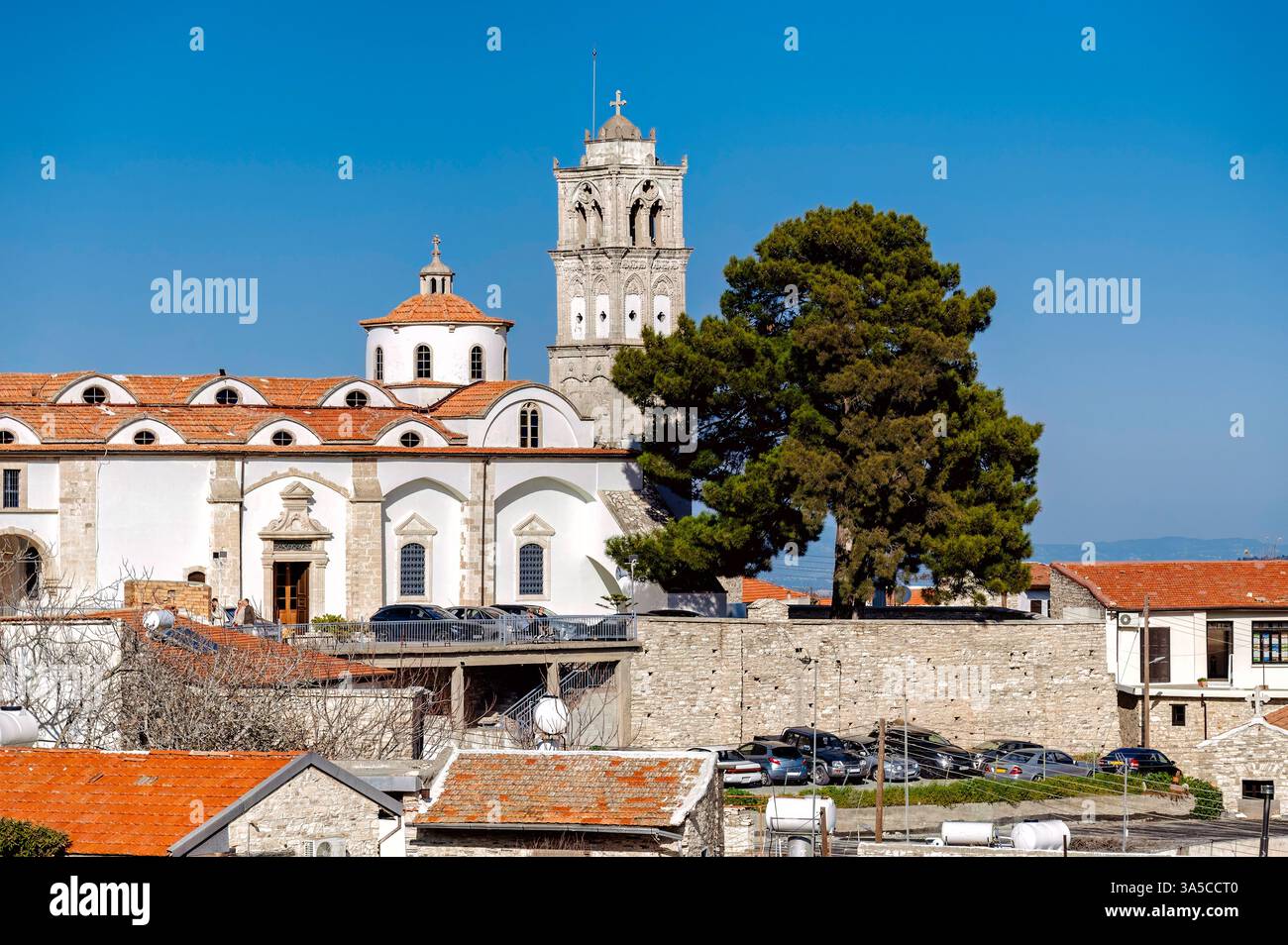 Whitewashed Church of the Holy Cross standing out among the traditional ...