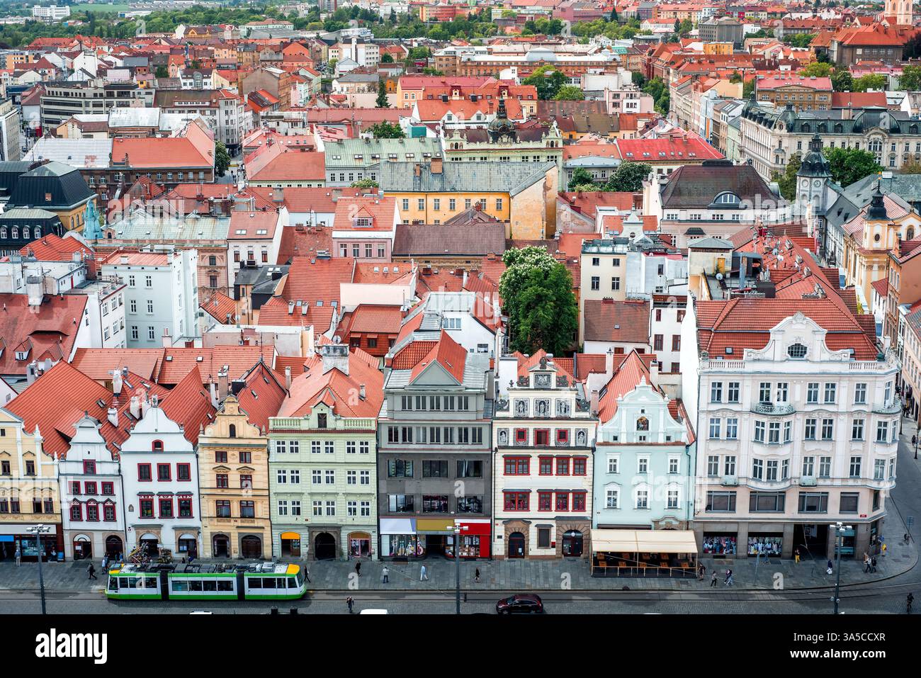 Red tram passing old square hi-res stock photography and images - Alamy