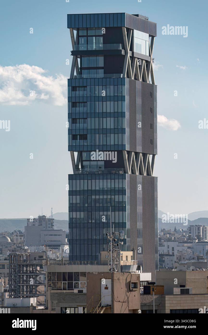 Modern skyscraper with unique design standing out against the urban ...