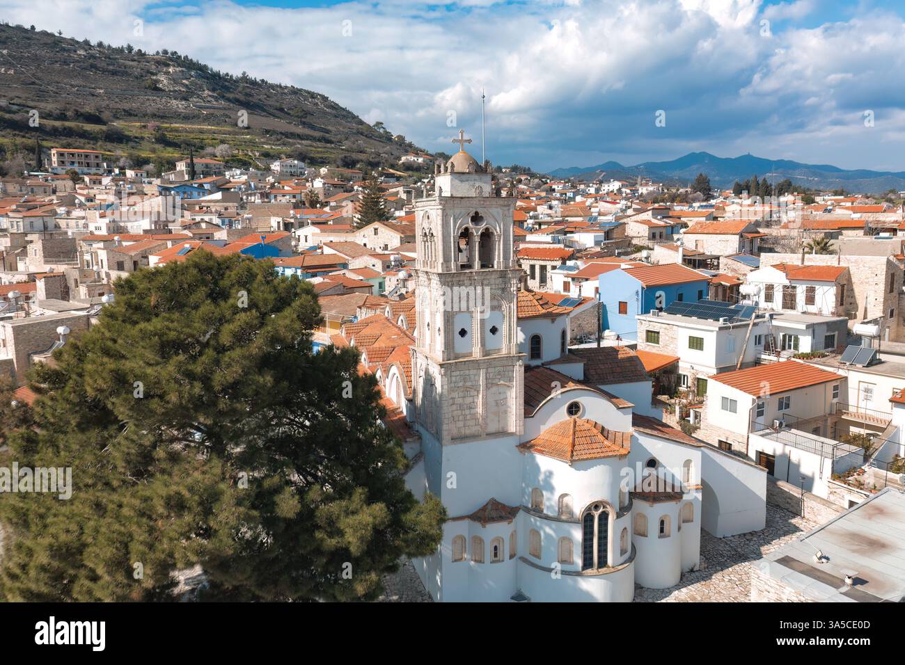 Church dominating the skyline of Pano Lefkara village on a bright sunny ...