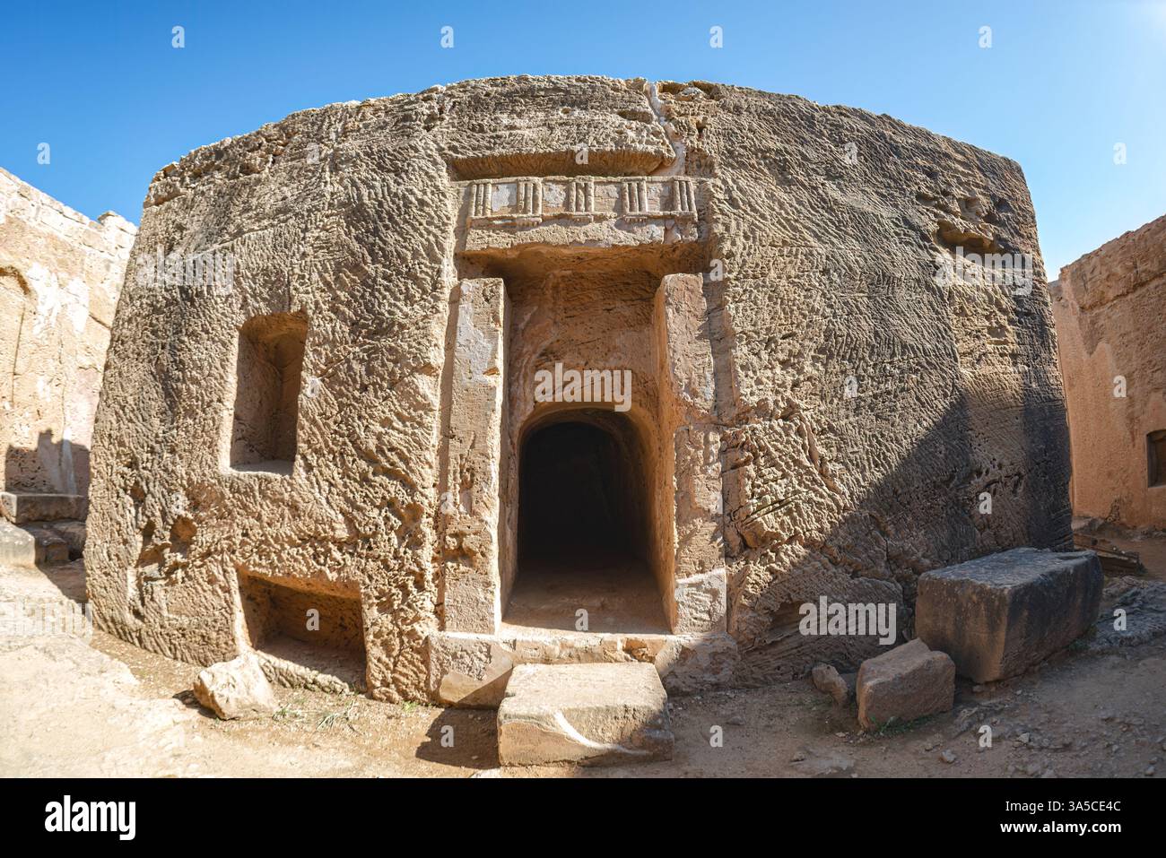 Majestic tomb entrance carved into rock at the Tombs of the Kings ...