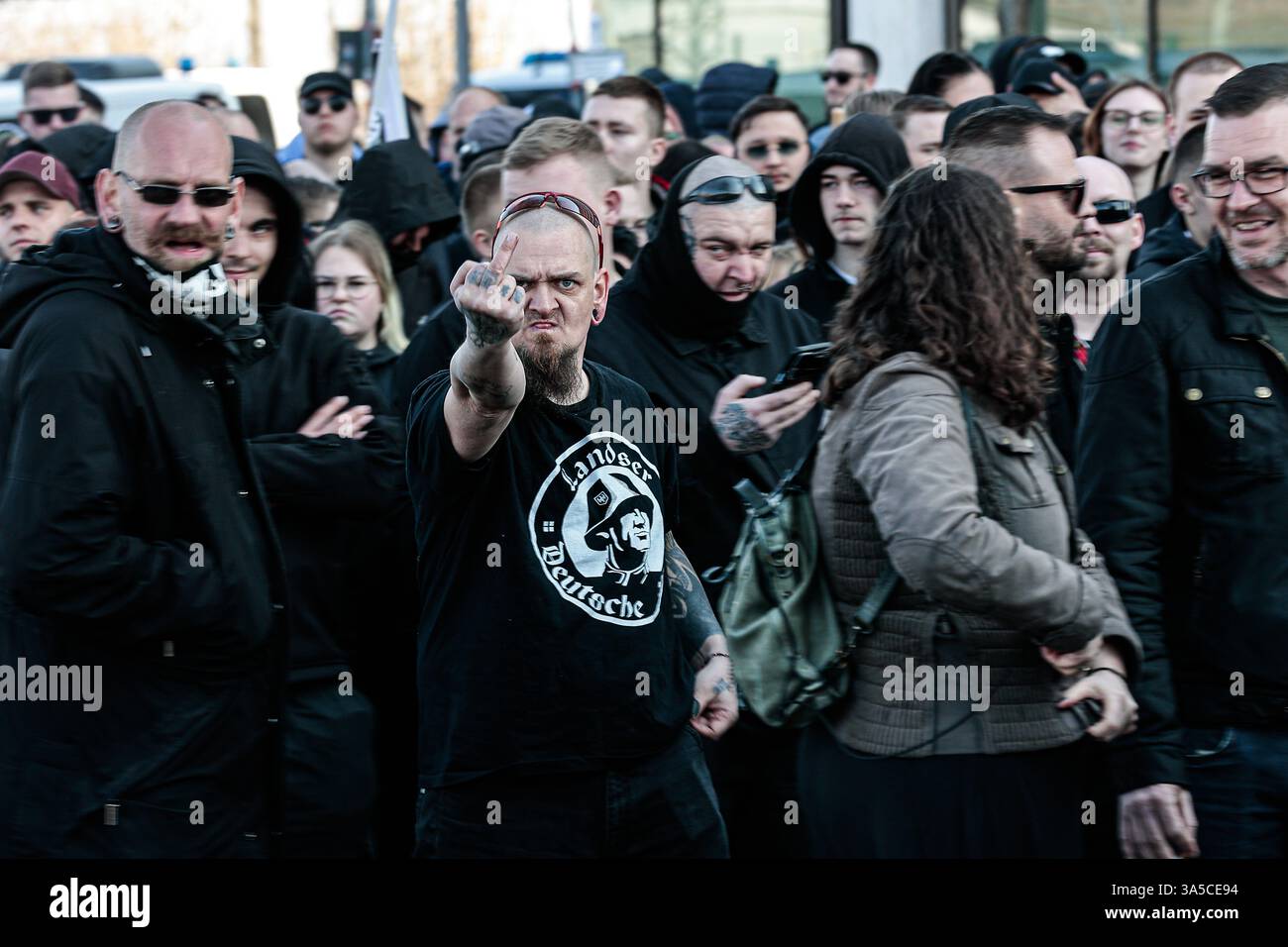 (EDITOR'S NOTE; Images contains profanity)A far-right activist gestures ...