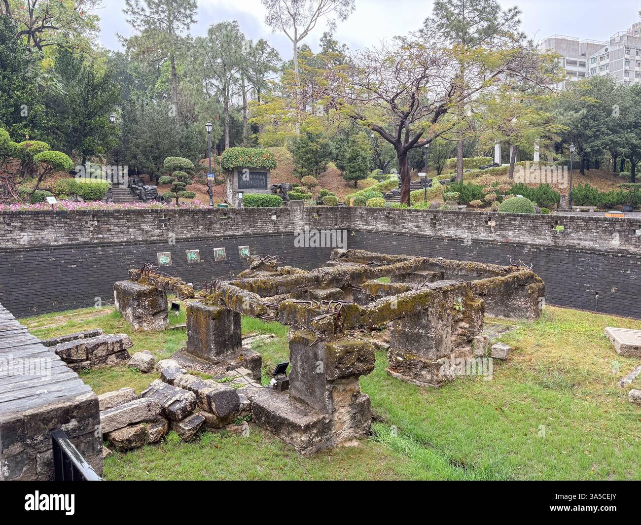Historic remnants of the South Gate at Kowloon Walled City Park, with ...