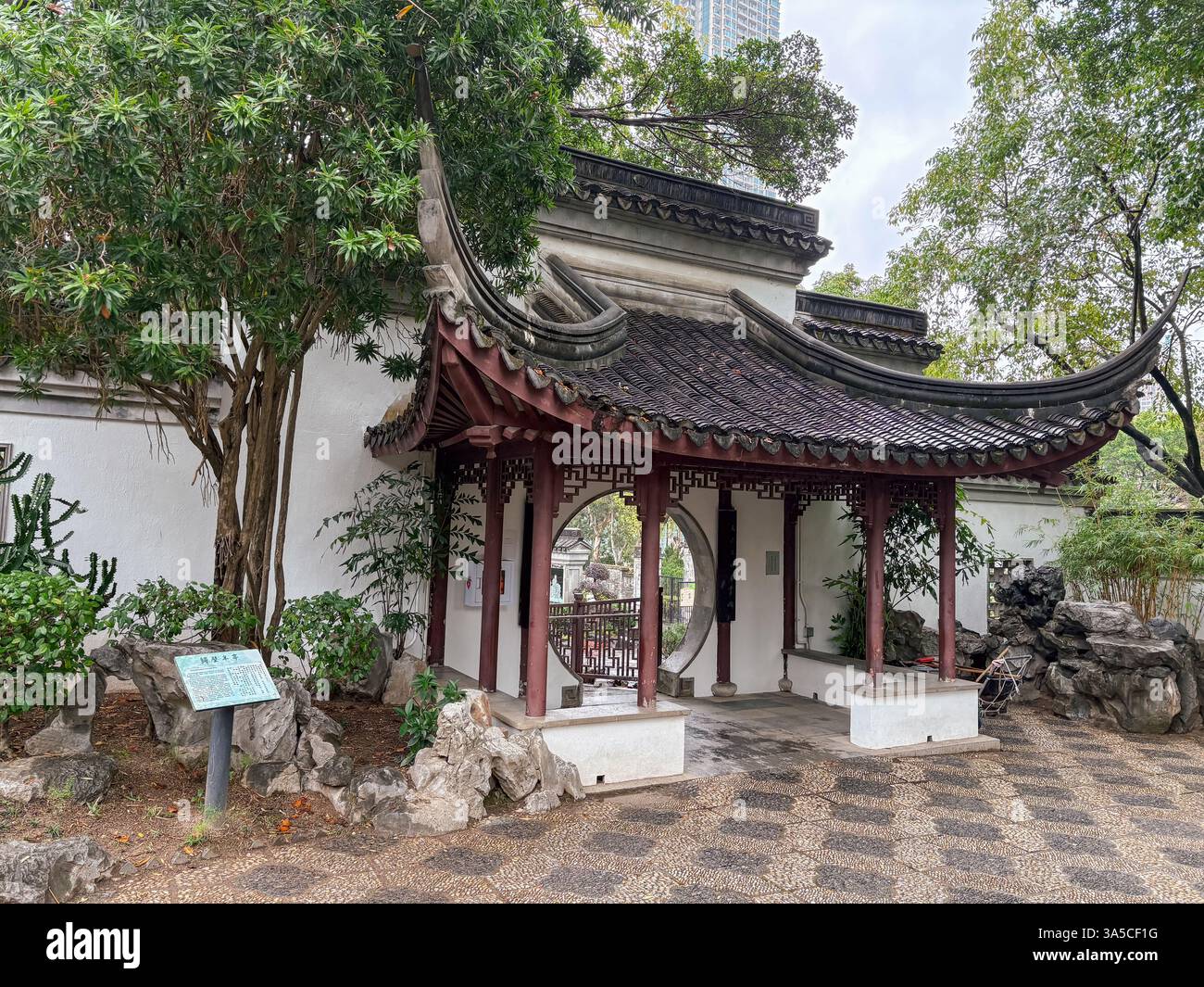 Traditional Chinese architecture in Kowloon Walled City Park with roof ...