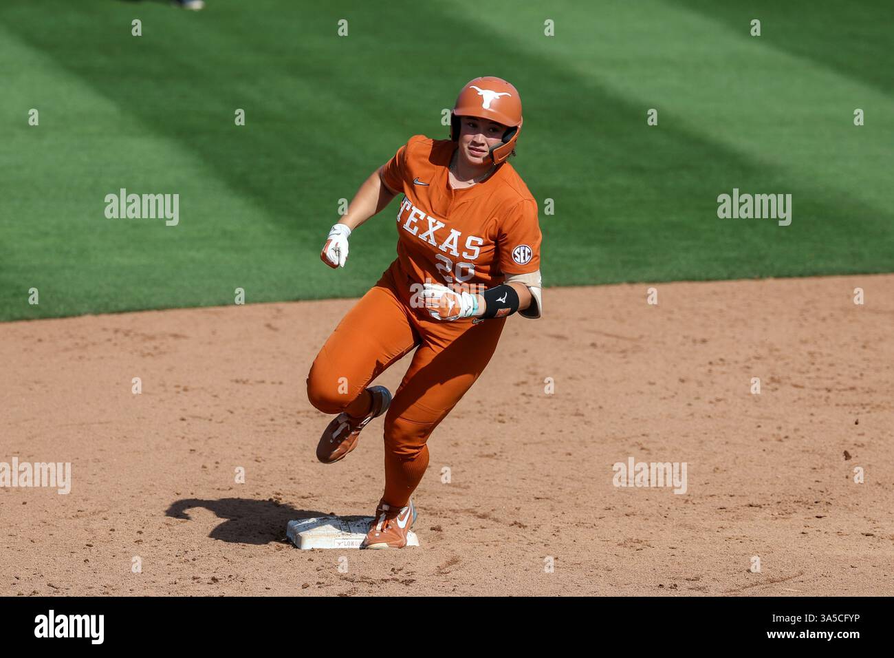 AUSTIN, TX - MARCH 22: Texas utility Katie Stewart (20) rounds second ...