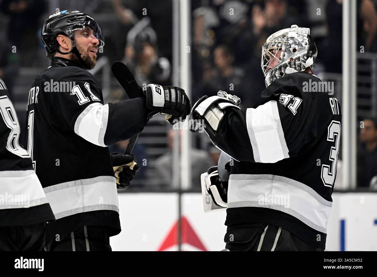 Los Angeles Kings center Anze Kopitar (11) celebrates with goaltender ...