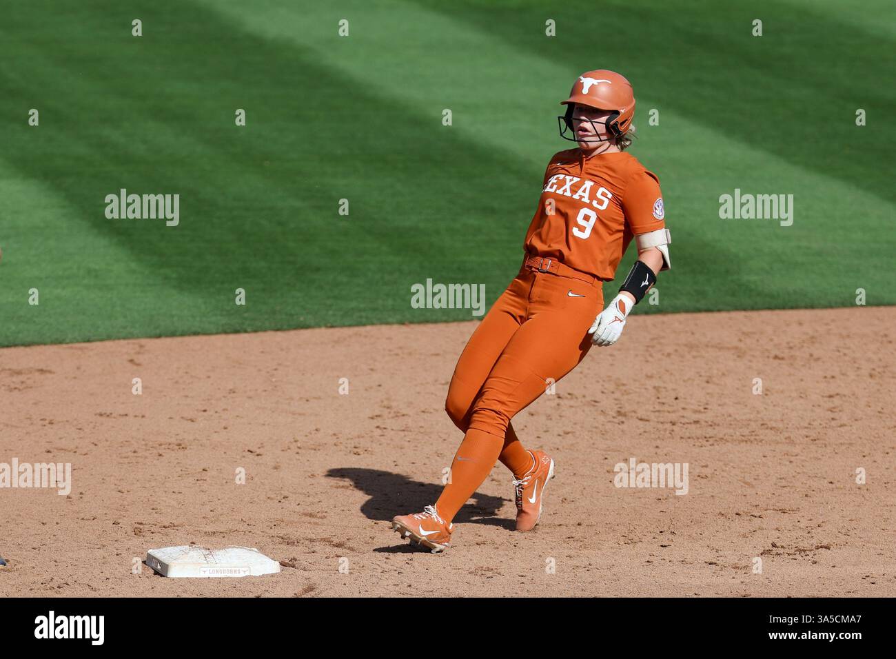 AUSTIN, TX - MARCH 22: Texas infielder Joley Mitchell (9) heads into ...