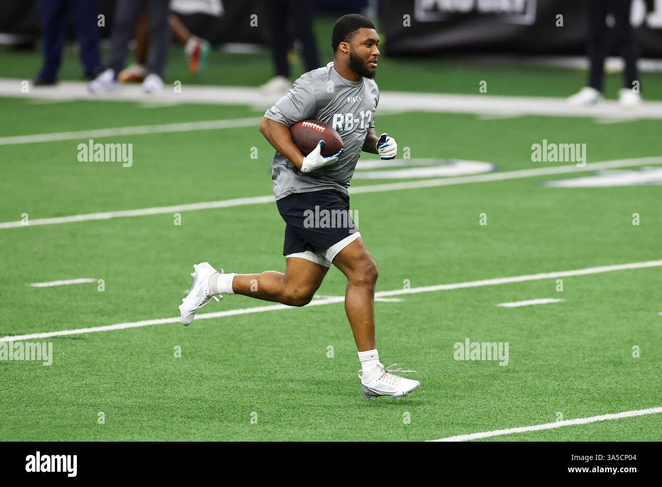 Kansas running back Devin Neal participates in a drill during the Big ...