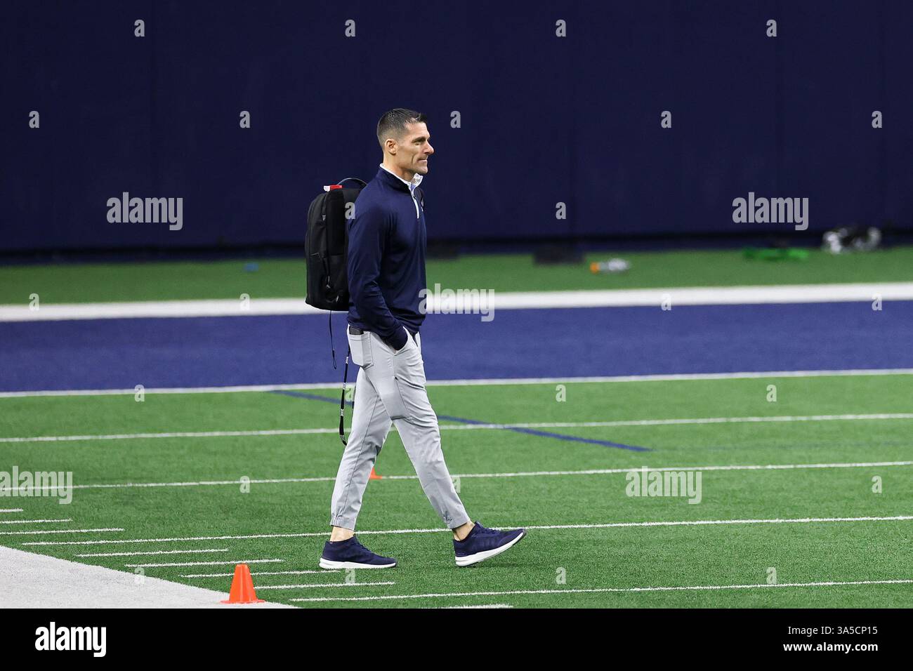 Houston Texans general manager Nick Caserio walks on the field on the ...