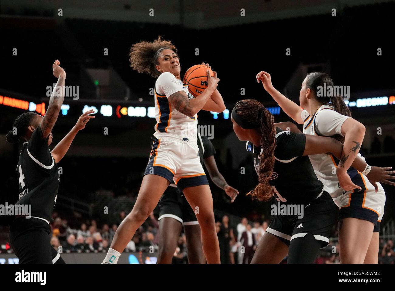California guard Jayda Noble, second from left, grabs a rebound during ...