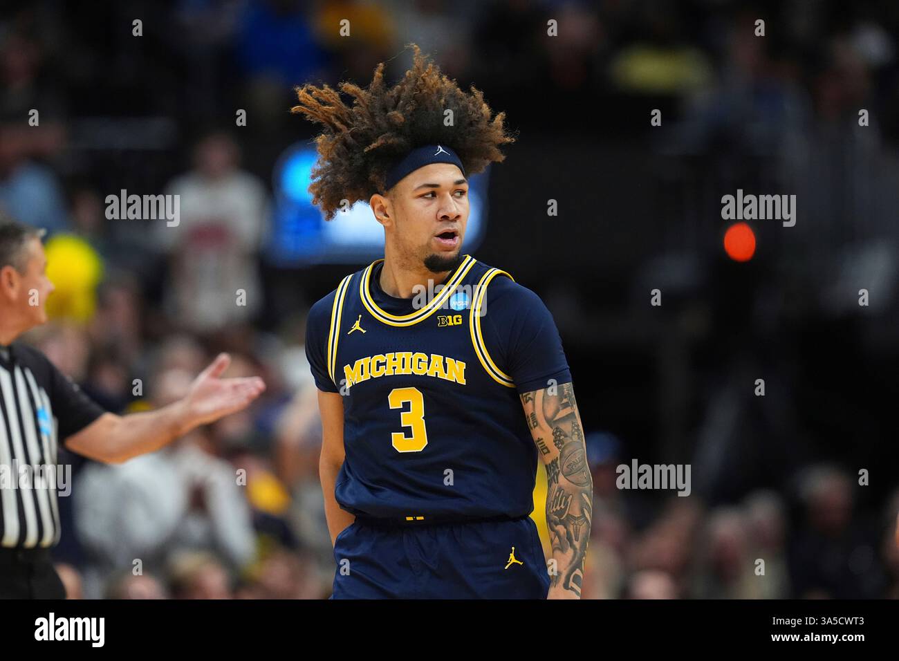 Michigan guard Tre Donaldson reacts after hitting a 3-point basket ...