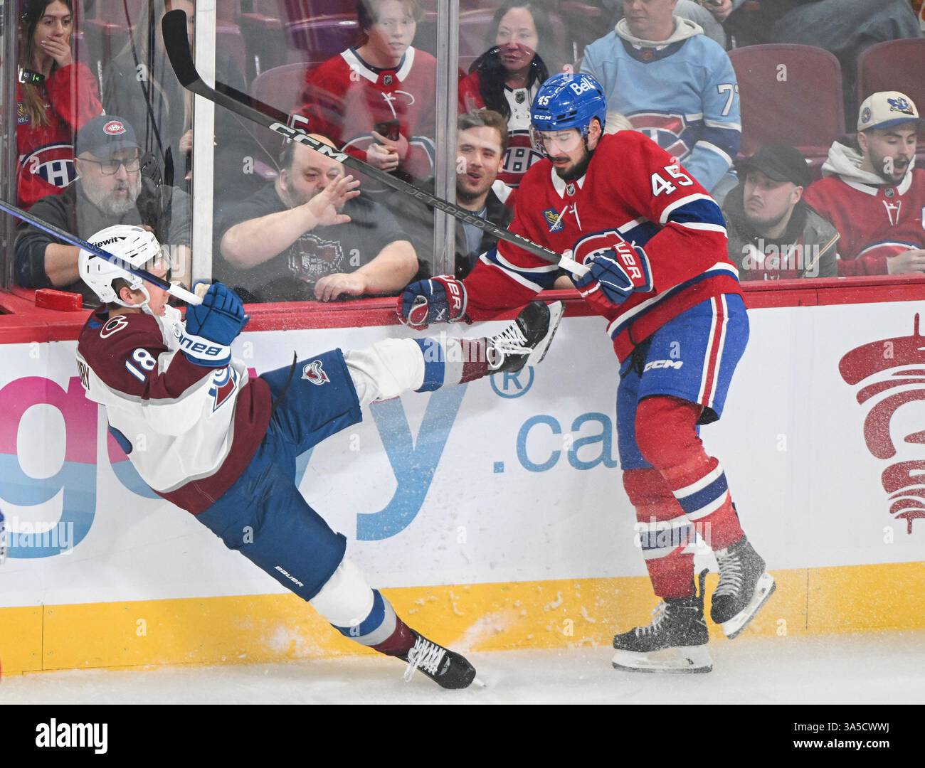 Montreal Canadiens' Alexandre Carrier (45) checks Colorado Avalanche's ...