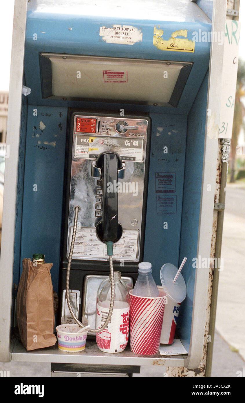 Los Angeles, California, USA, approx. 1985. Trash on a public phone ...