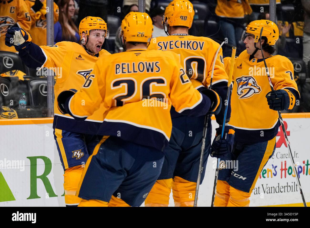 Nashville Predators left wing Michael Bunting, left, celebrates his ...