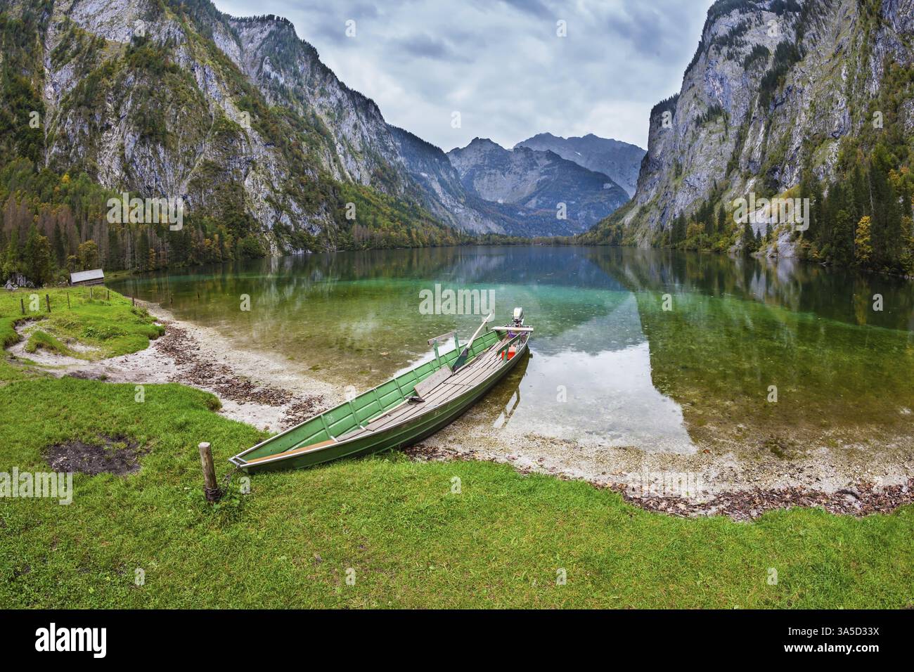 Concept of active tourism. The magic blue lake Obersee in Bavarian Alps ...