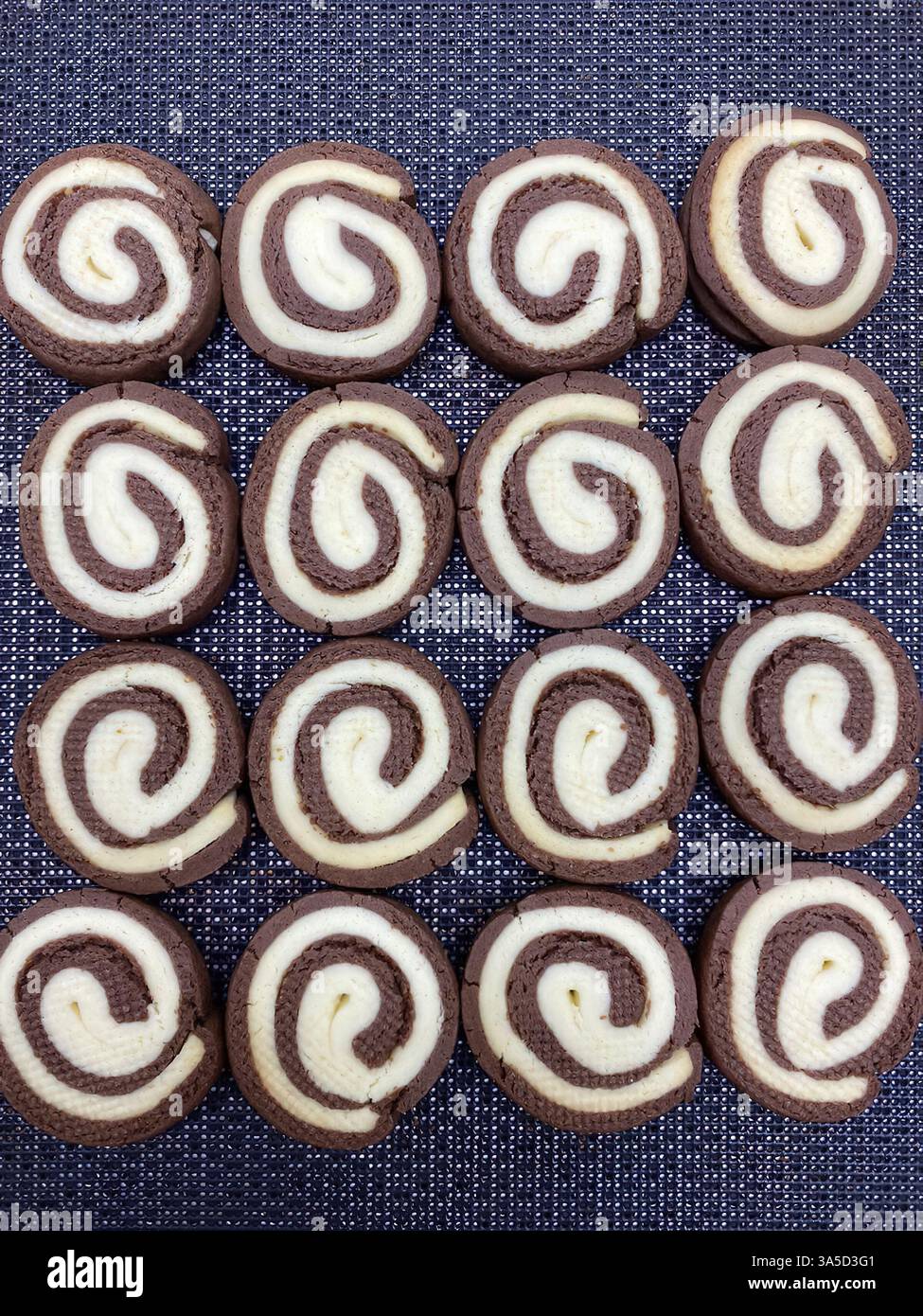 Circular cookies are perfectly arranged in rows displaying a delightful ...