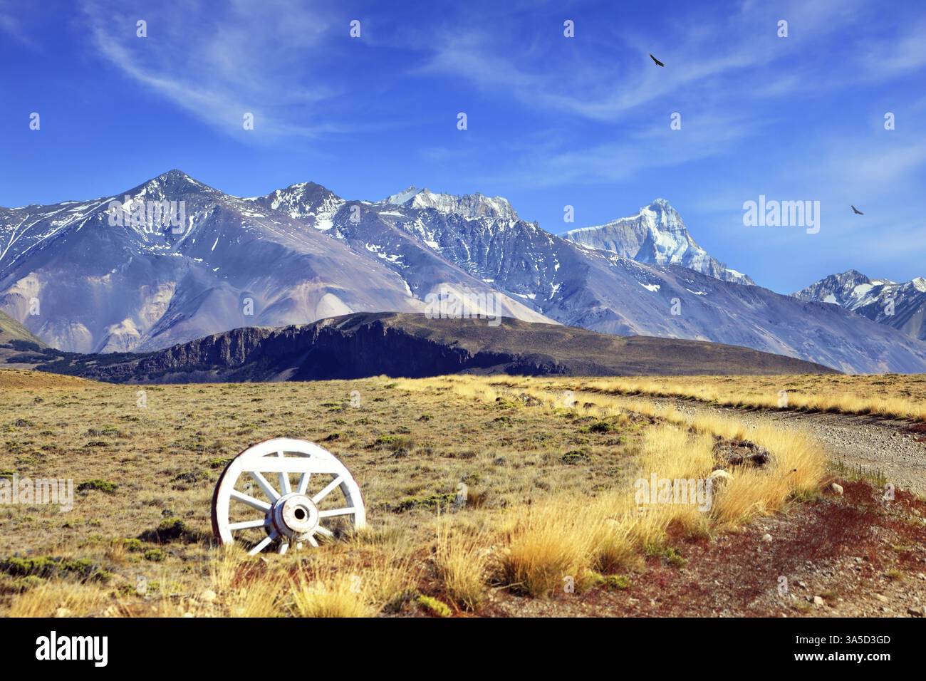 Road sign in the form of a wagon wheel. Gravel road in the desert. In ...