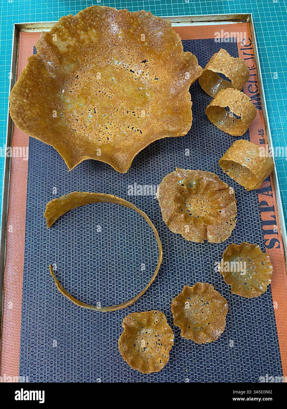 Intricate bakery products arranged on a workspace, emphasizing ...