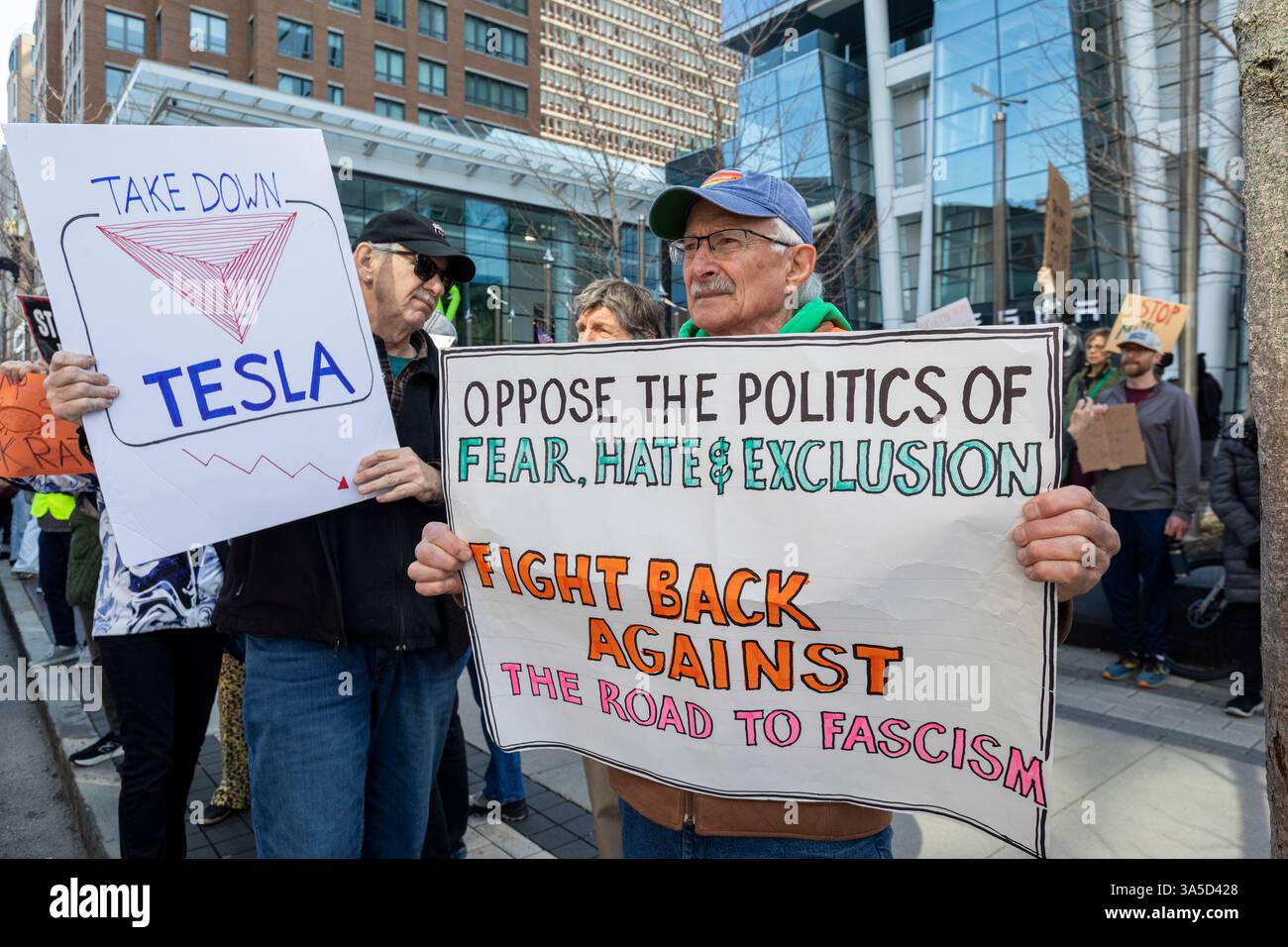 March 22, 2025. Boston, MA. Over 450 people gathered outside the Tesla ...