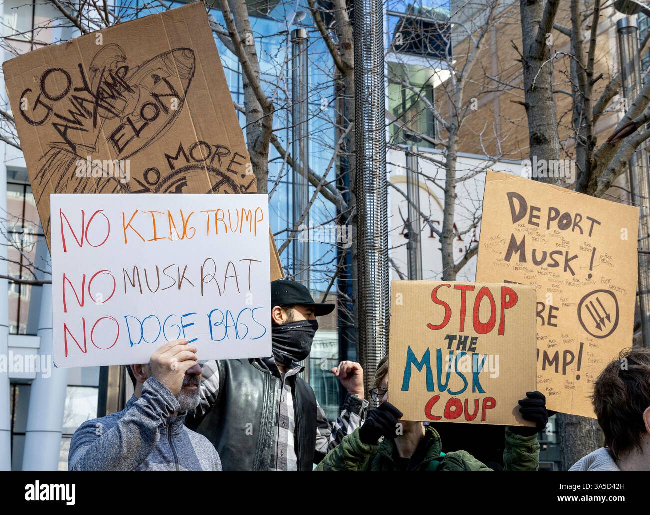 March 22, 2025. Boston, MA. Over 450 people gathered outside the Tesla ...