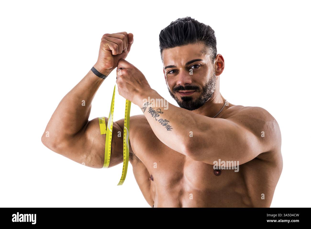 Muscular bodybuilder man measuring thigh with tape measure, close-up ...