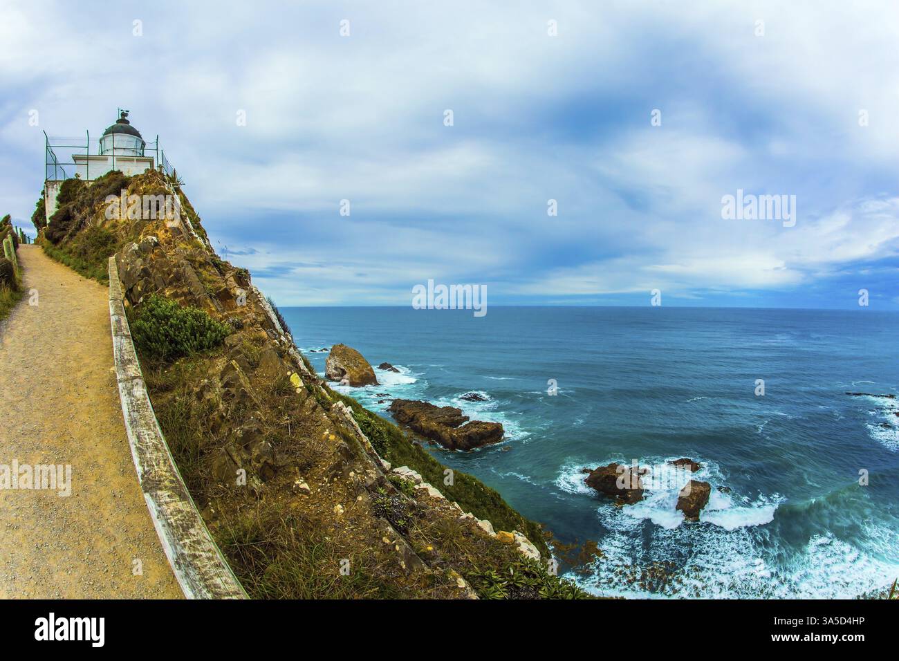 The white building of the lighthouse looks spectacular on a high cape ...
