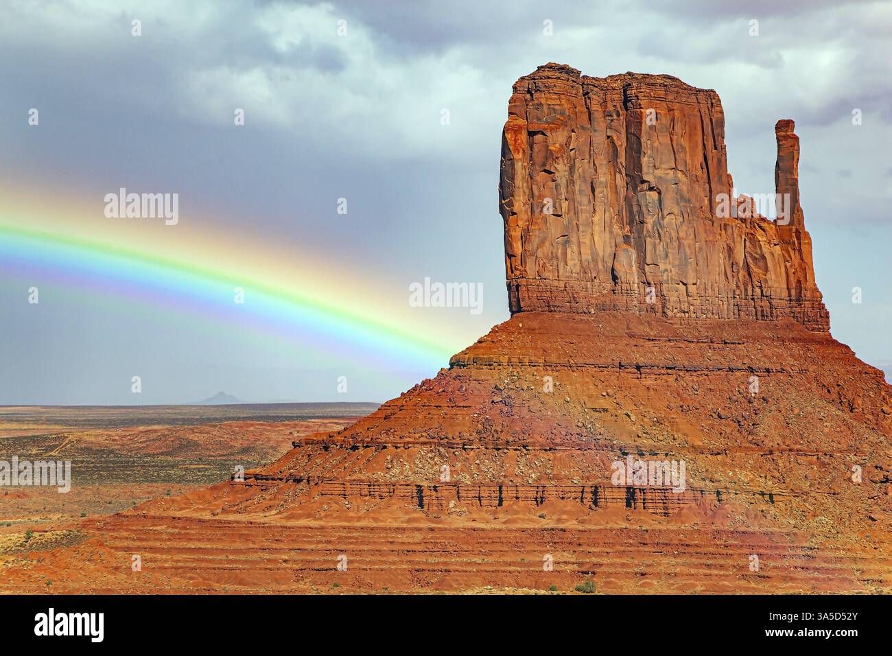 The famous rock Mittens and the bright rainbow. USA. Navajo Indian ...