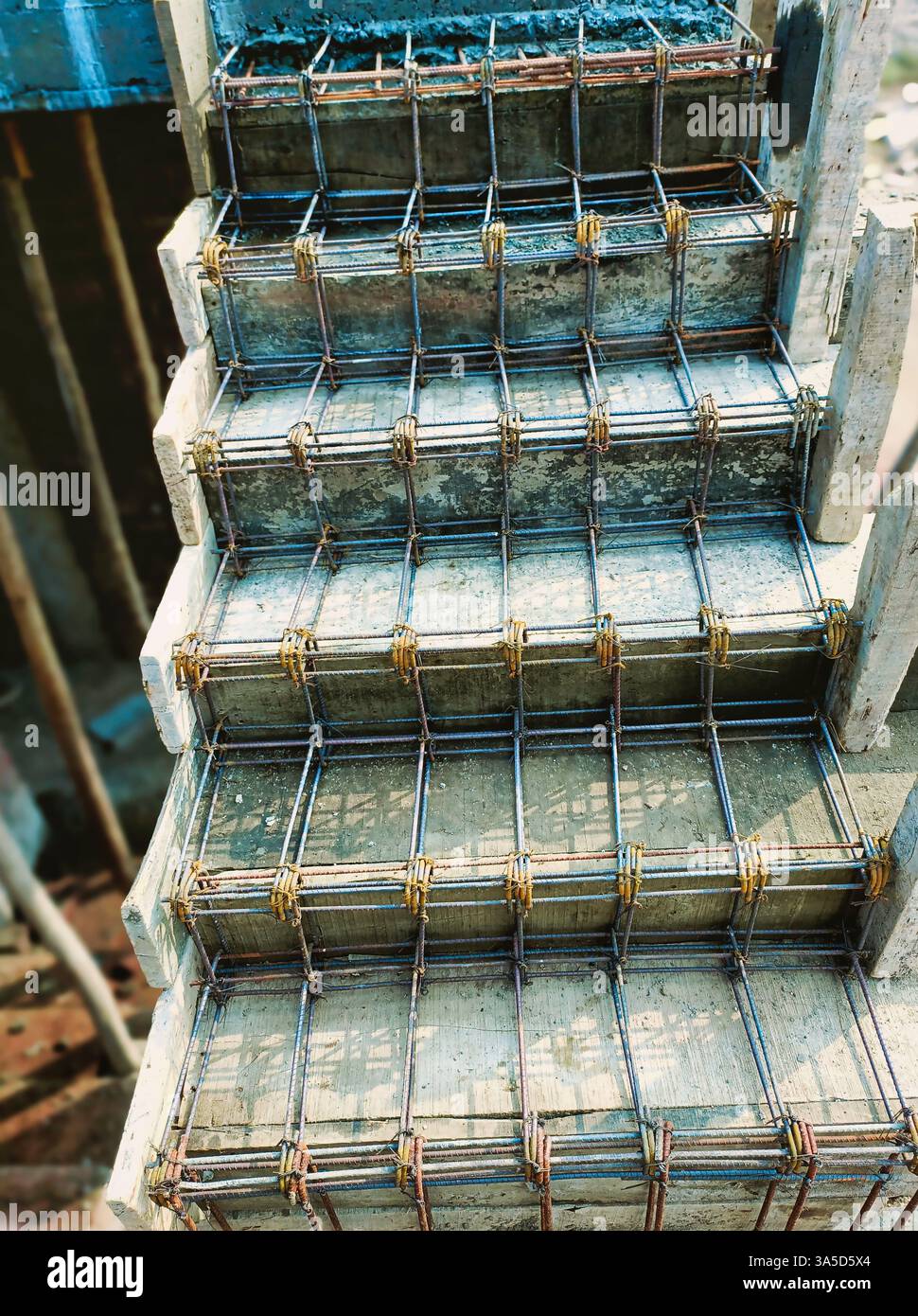 Workers prepare for the installation of reinforced concrete stairs ...