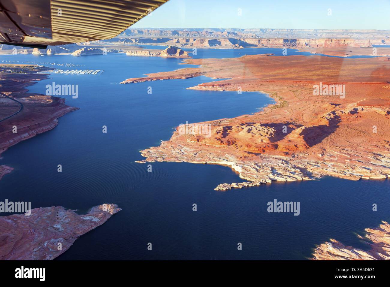 Landscape under the wing of an airplane. Lake Powell is a reservoir on ...