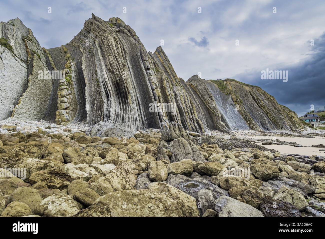 Portio Beach, Cantabria Beaches. Giant rough gray rocks and smooth ...
