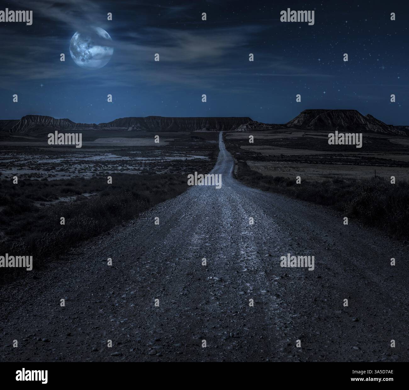 Moon, stars and clouds in the night. Wild west road illuminated from ...